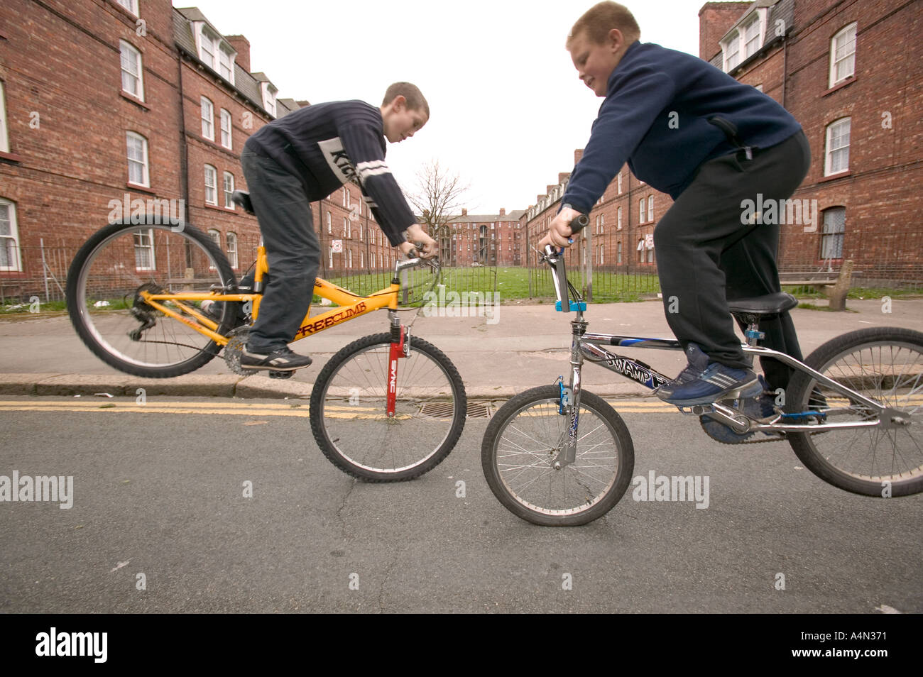 Kids playing on bikes hi-res stock photography and images - Alamy