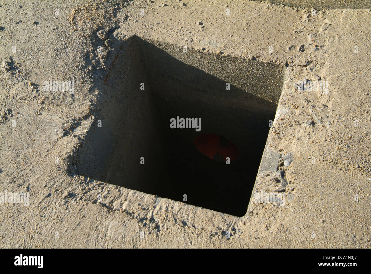 Hole in the road Stock Photo - Alamy