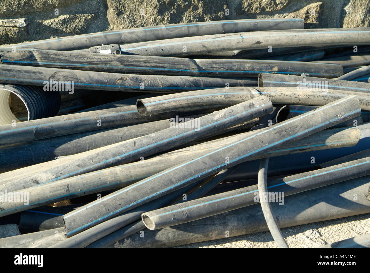 Unused water plastic pipes Stock Photo - Alamy