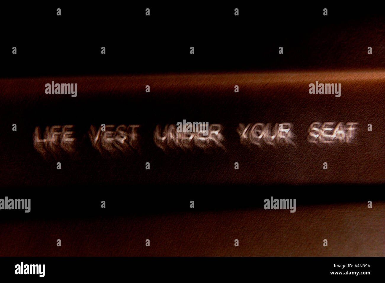 Life vest under your seat safety sign on aeroplane Stock Photo - Alamy