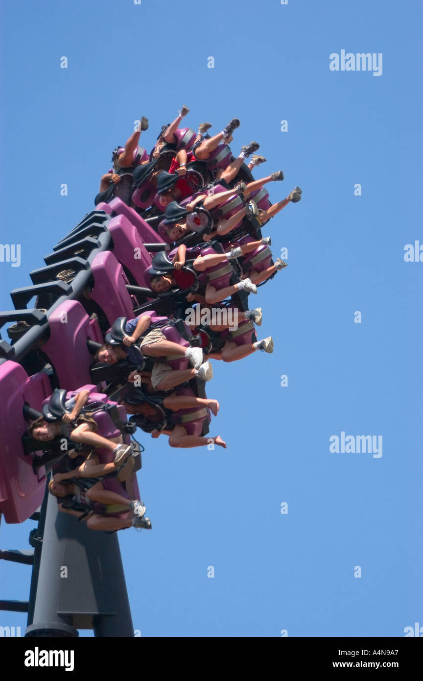Roller coaster with riders Stock Photo - Alamy