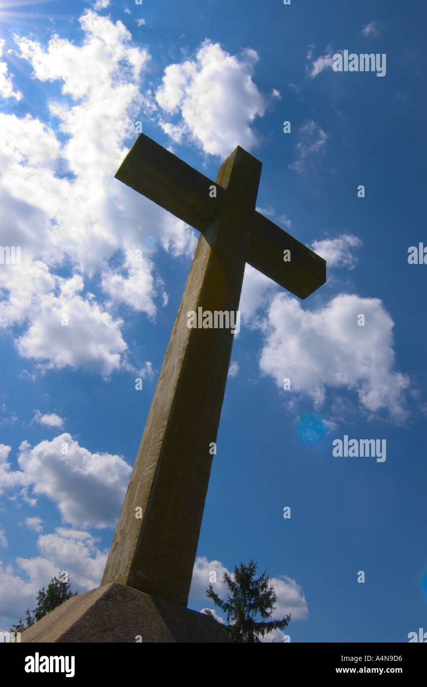 Towering Christian cross against blue sky with clouds Stock Photo - Alamy