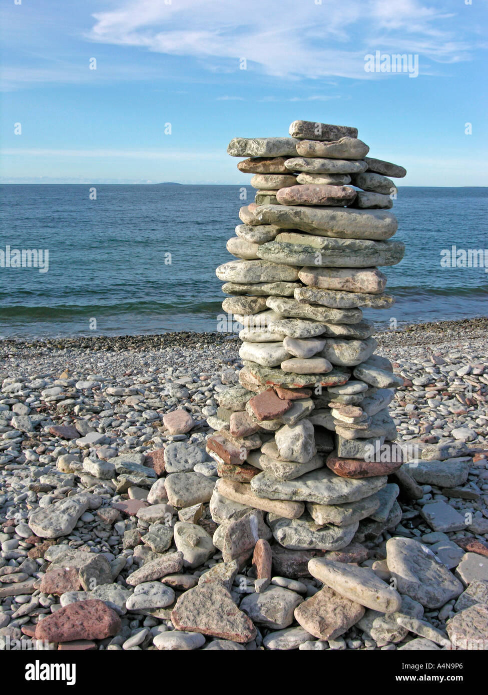 tower of piled stones on stony western coast of island Oland Sweden ...