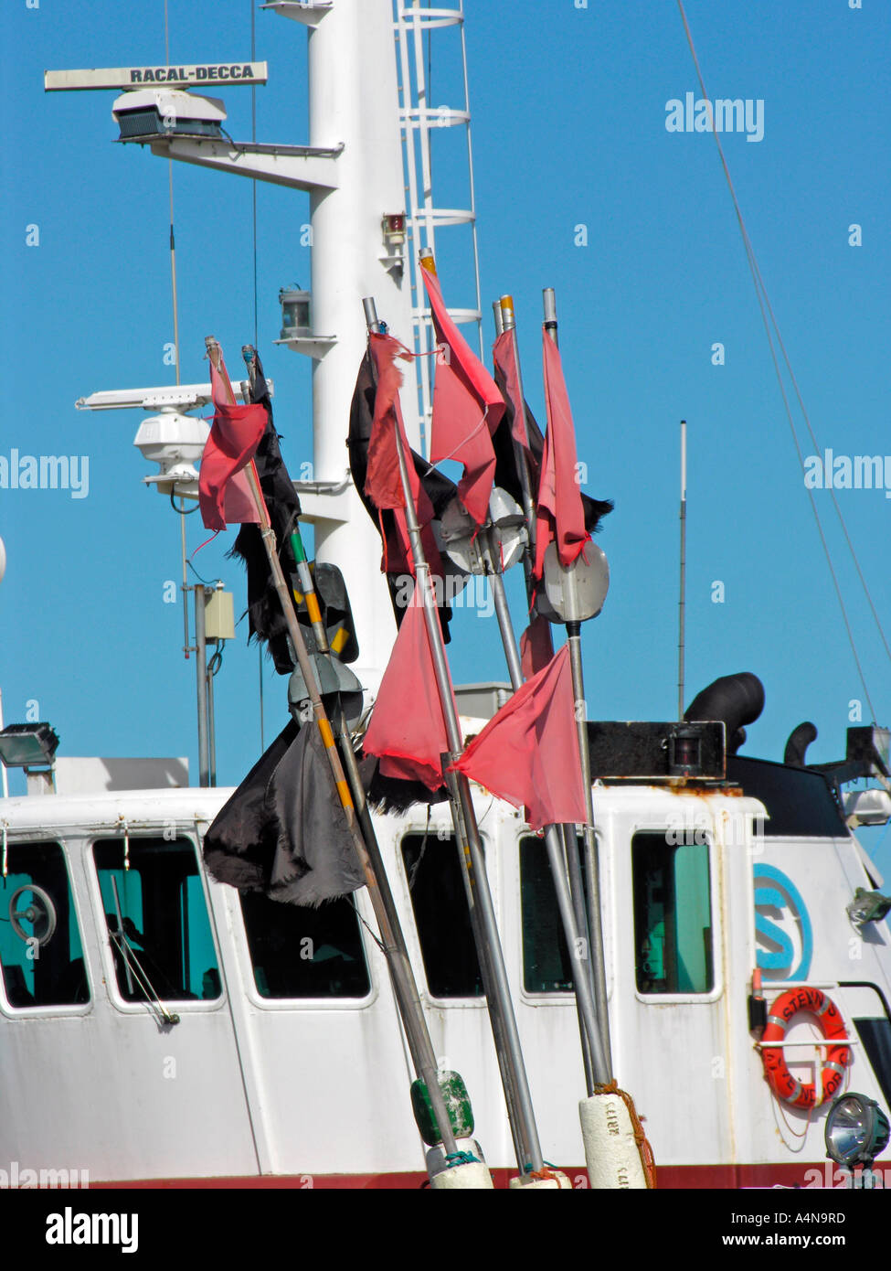 markings tags rods with flags on fishing boat Stock Photo - Alamy