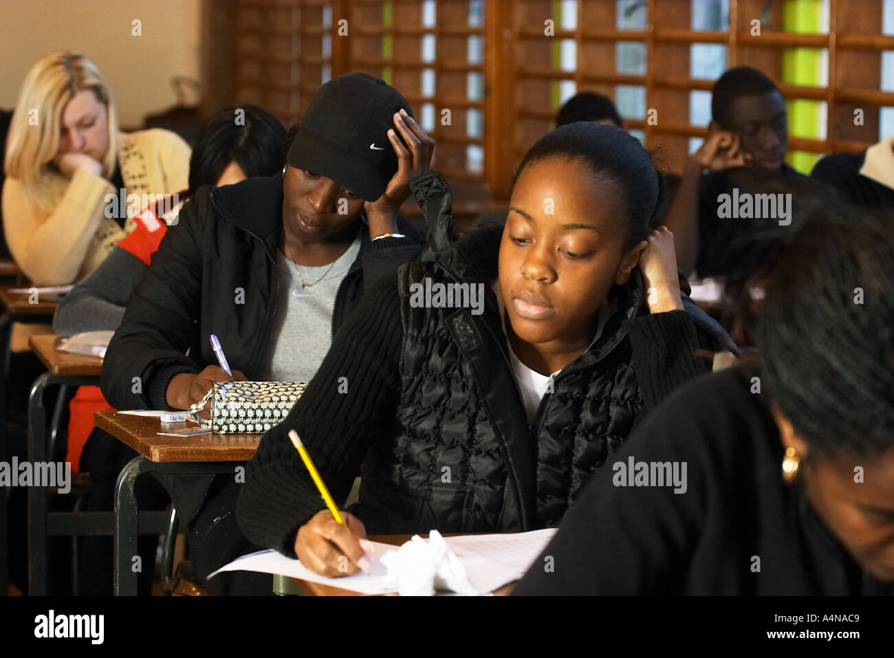 Pupils teenagers stress joy sadness papers writing hi-res stock ...