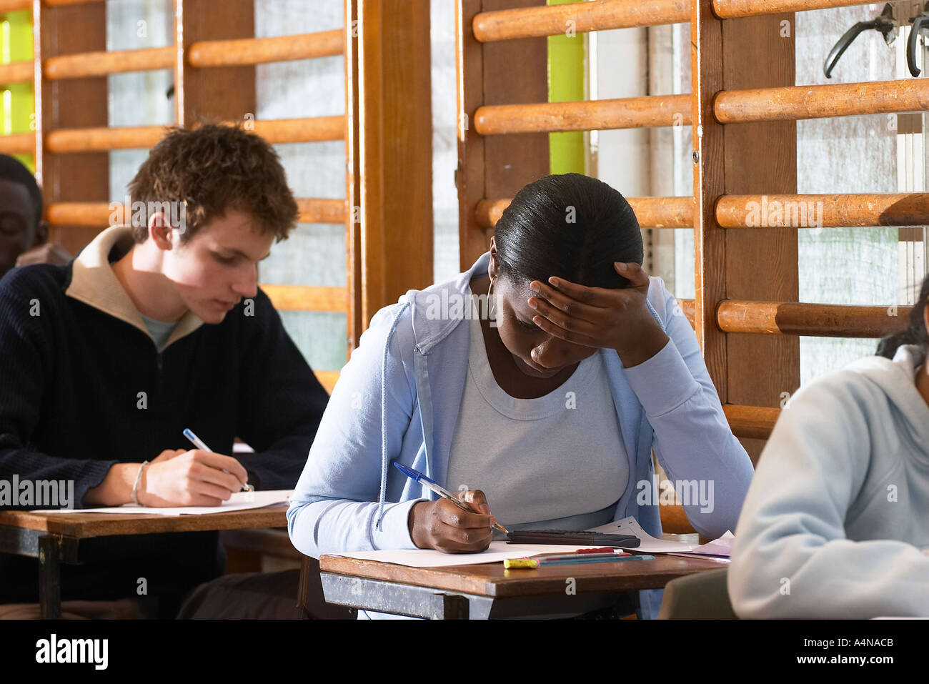 Pupils teenagers stress joy sadness papers writing hi-res stock ...