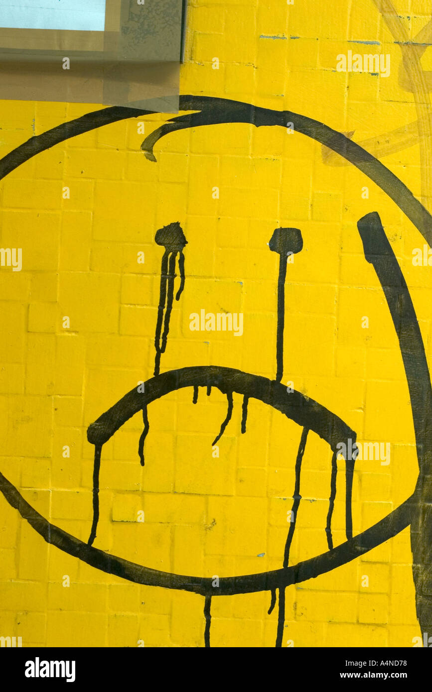 Sad face graffiti on wall hi-res stock photography and images - Alamy