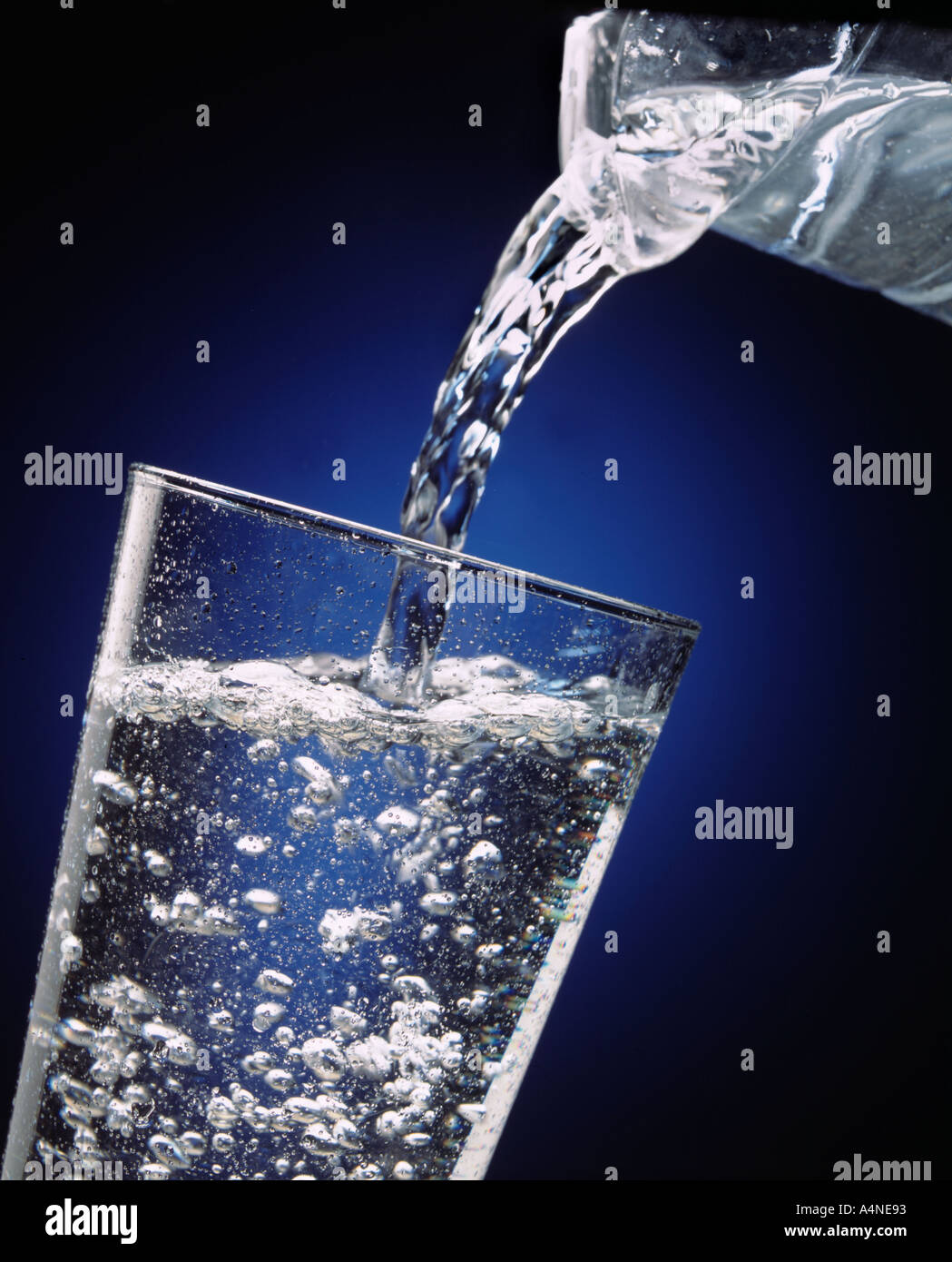 pitcher of water pouring into glass Stock Photo - Alamy