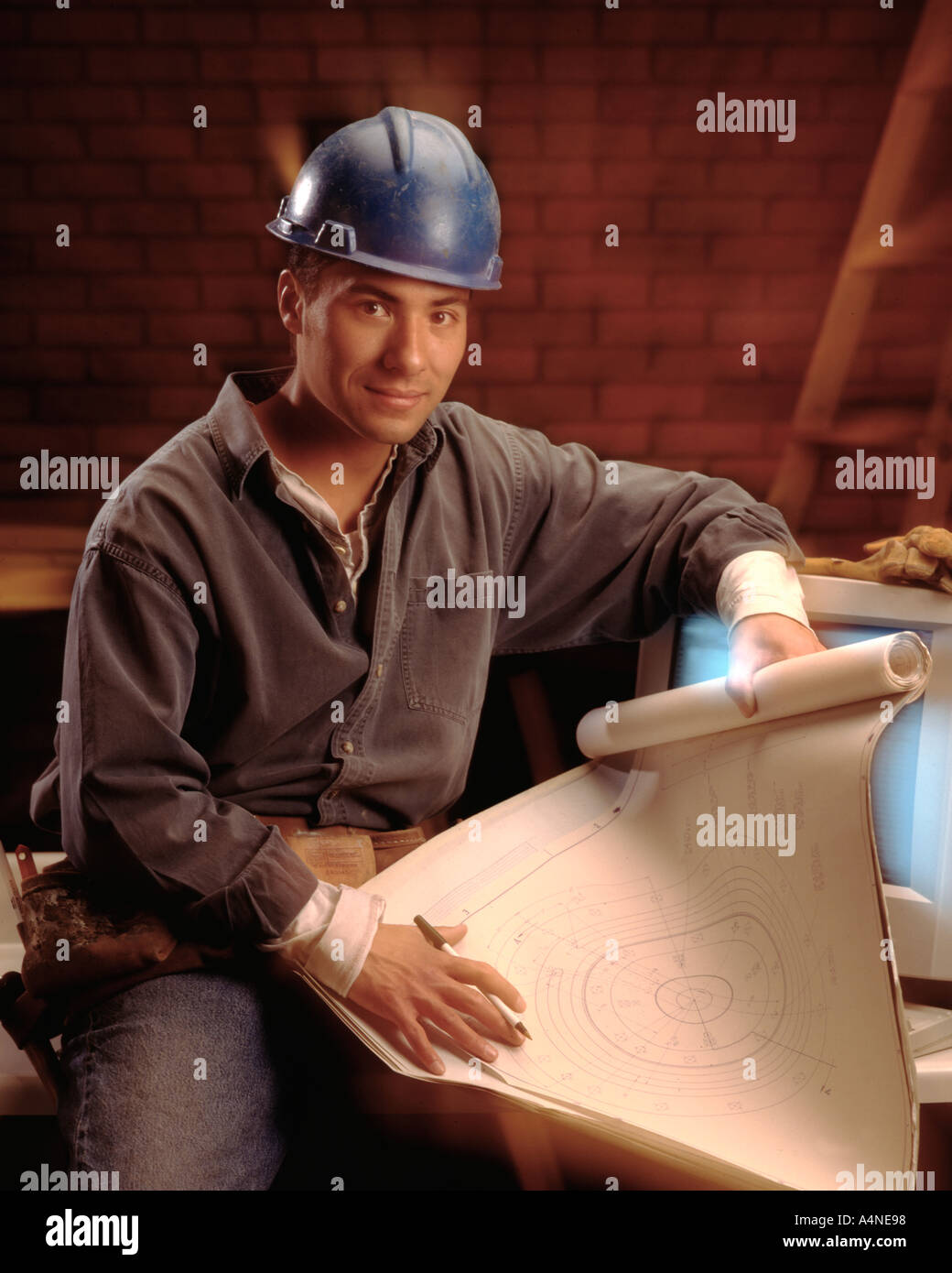 construction worker at work site with blueprints Stock Photo - Alamy