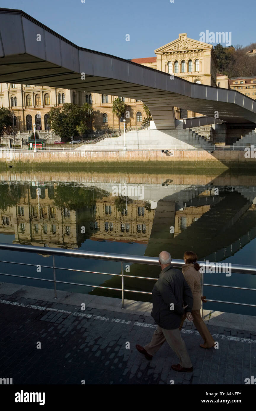 Two people walking towards Puente Pedro Arrupe bridge, Deusto ...