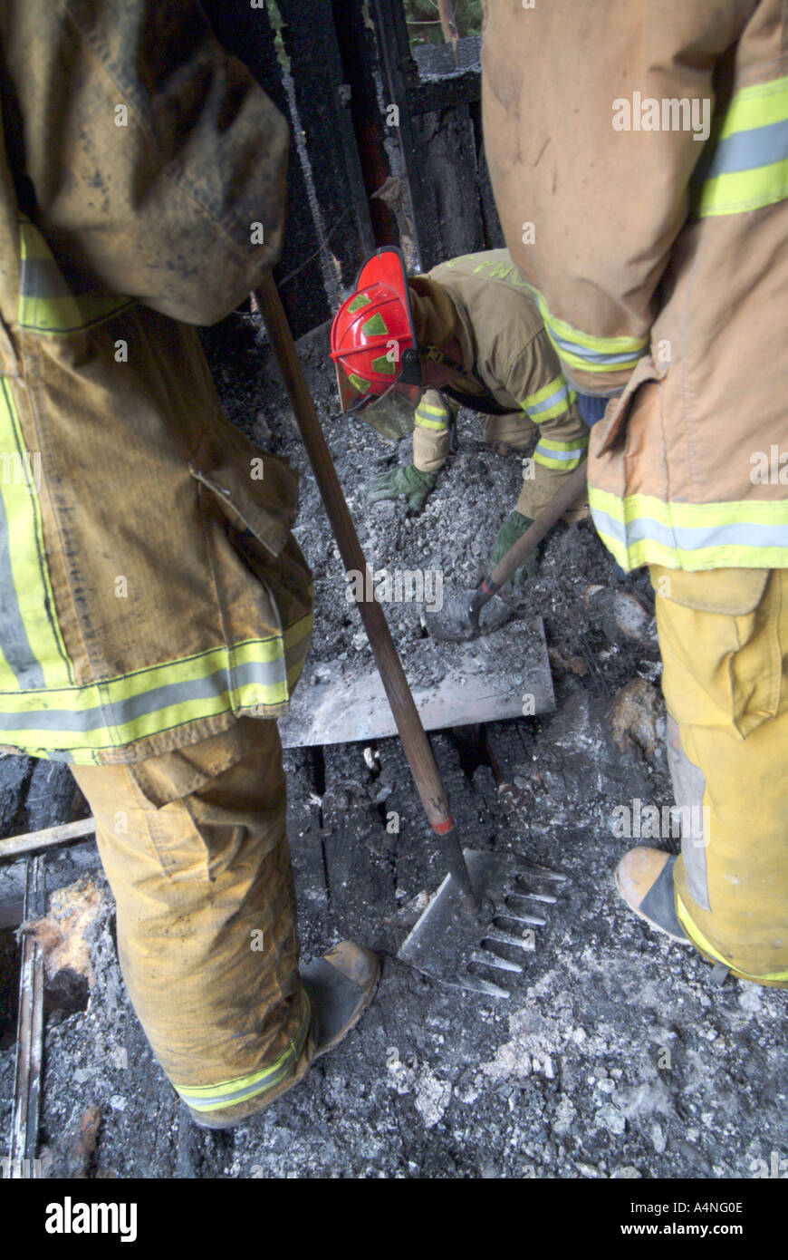 Fire fighters from several agencies investigate the cause of a ...