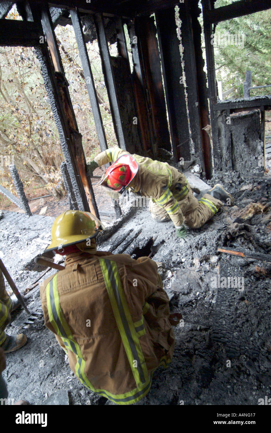 Fire fighters from several agencies investigate the cause of a ...