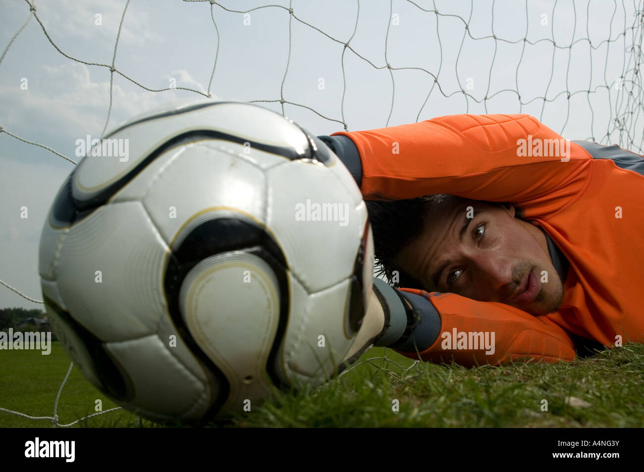 Goalkeeper reaching ball hi-res stock photography and images - Alamy