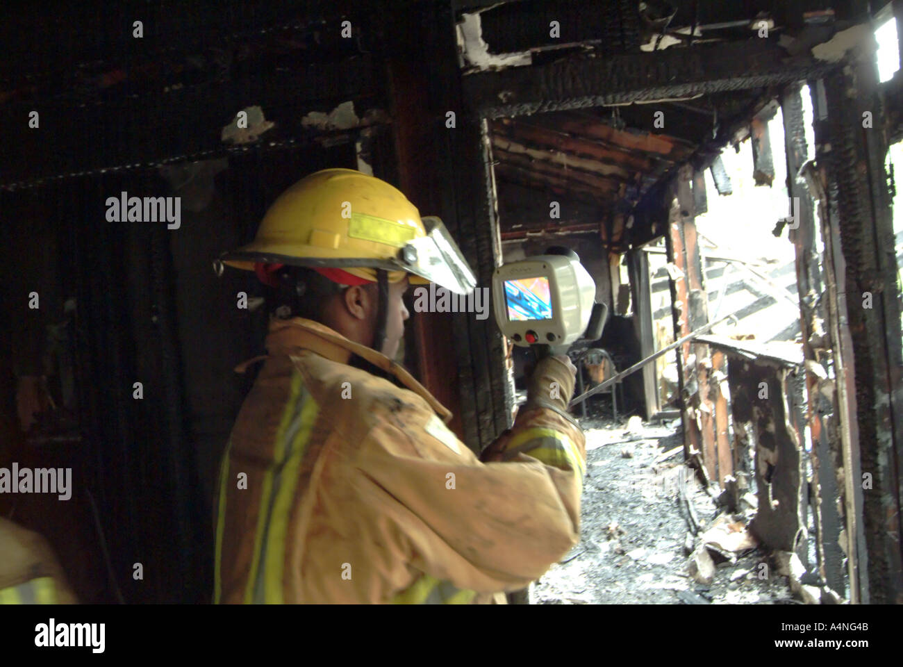 Fire fighters from several agencies investigate the cause of a ...