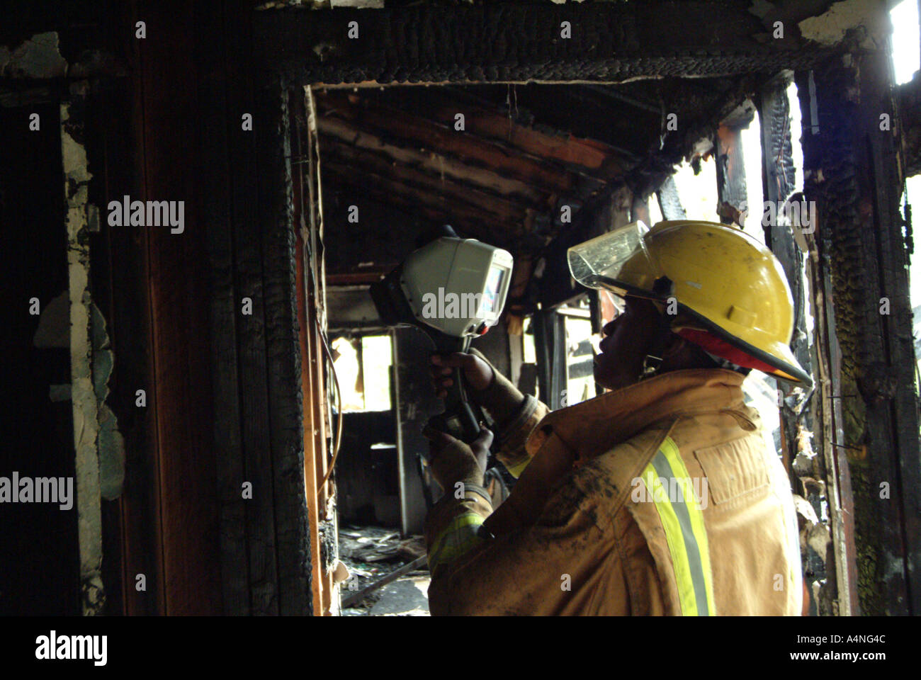 Fire fighters from several agencies investigate the cause of a ...