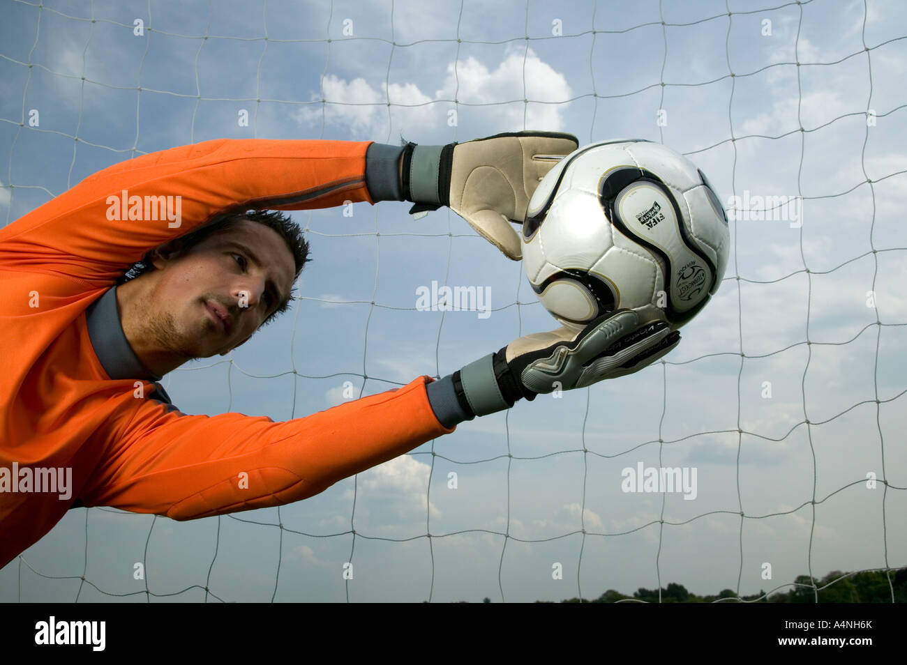 Goalkeeper reaching ball hi-res stock photography and images - Alamy