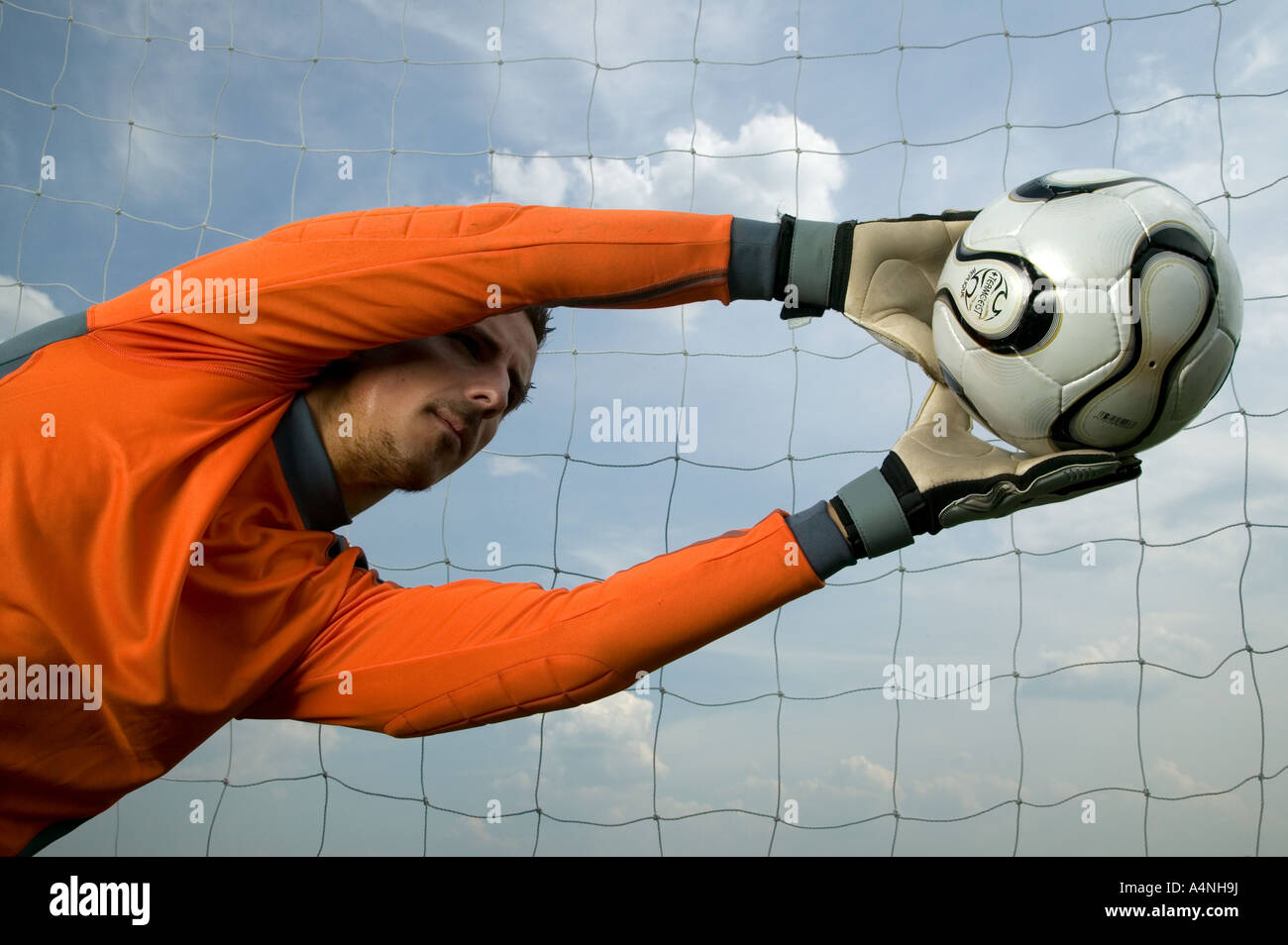 Goalkeeper reaching for ball hi-res stock photography and images - Alamy