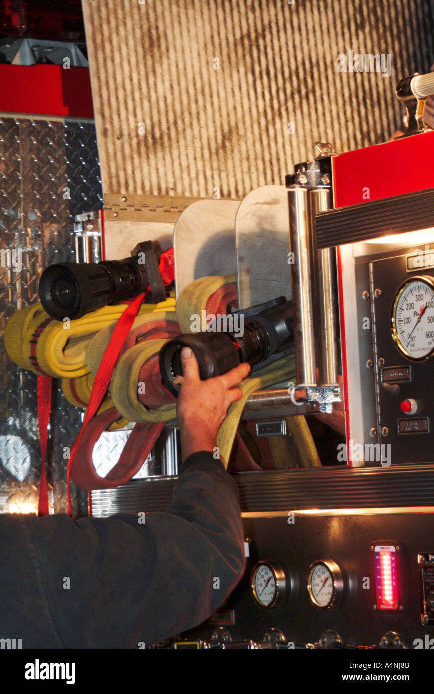 Firefighter pulling a hose hi-res stock photography and images - Alamy