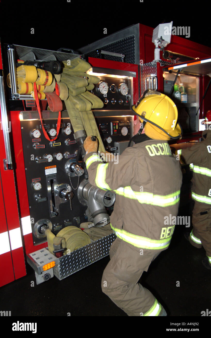 Firefighter pulling a hose hi-res stock photography and images - Alamy