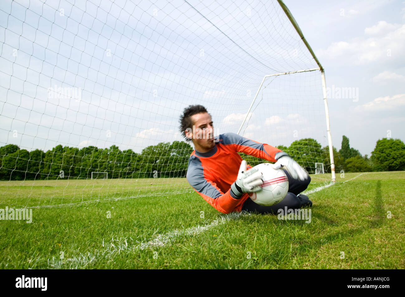 Saving a goal Stock Photo - Alamy