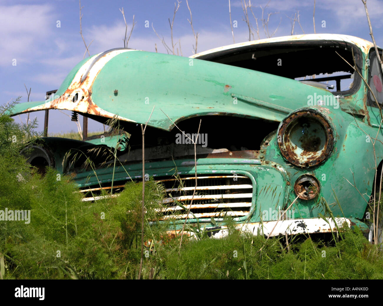 Trashed Morris Minor Van in a field Stock Photo - Alamy