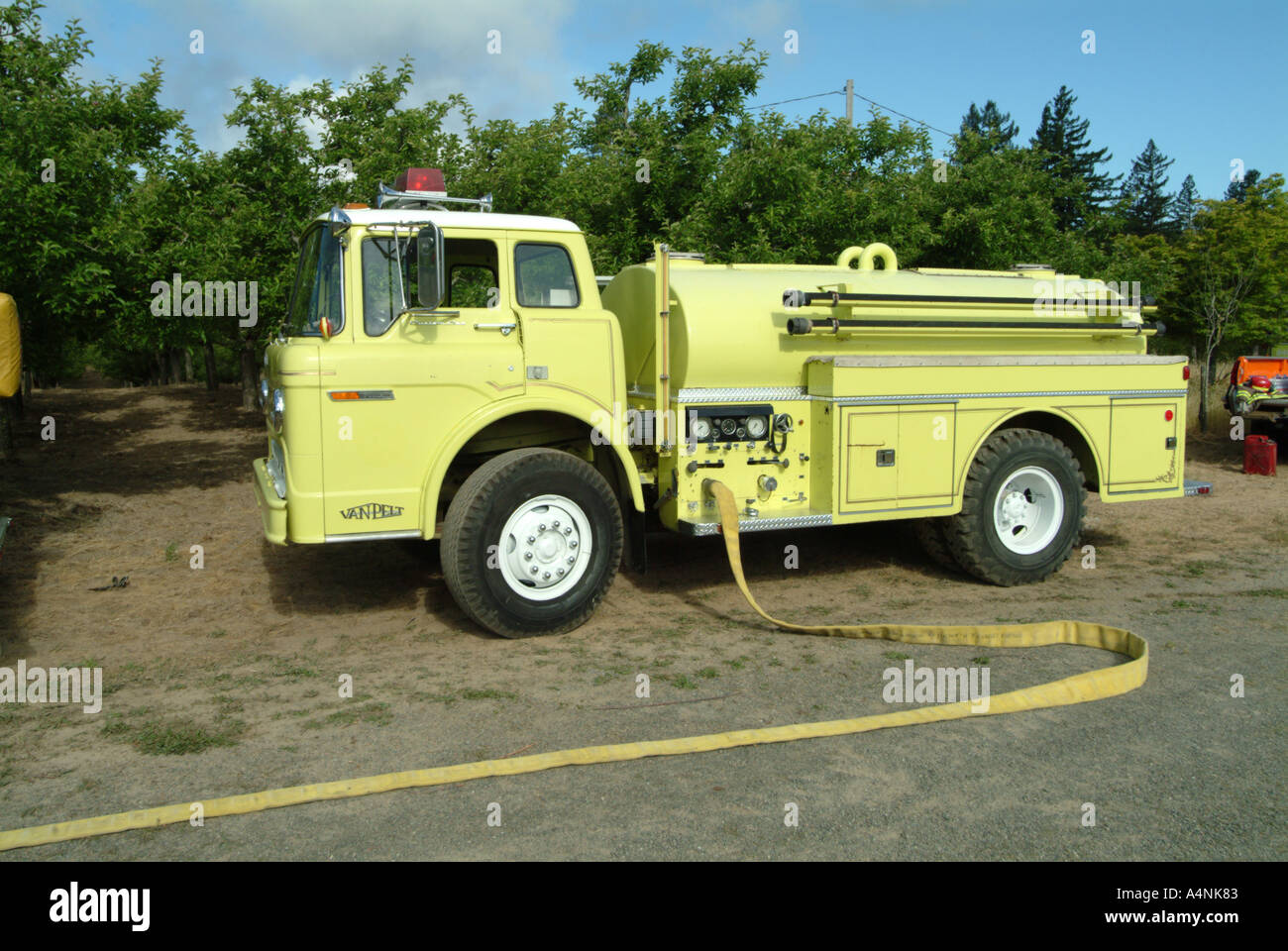 A water tender is set up to deliver water at a structure fire Stock ...