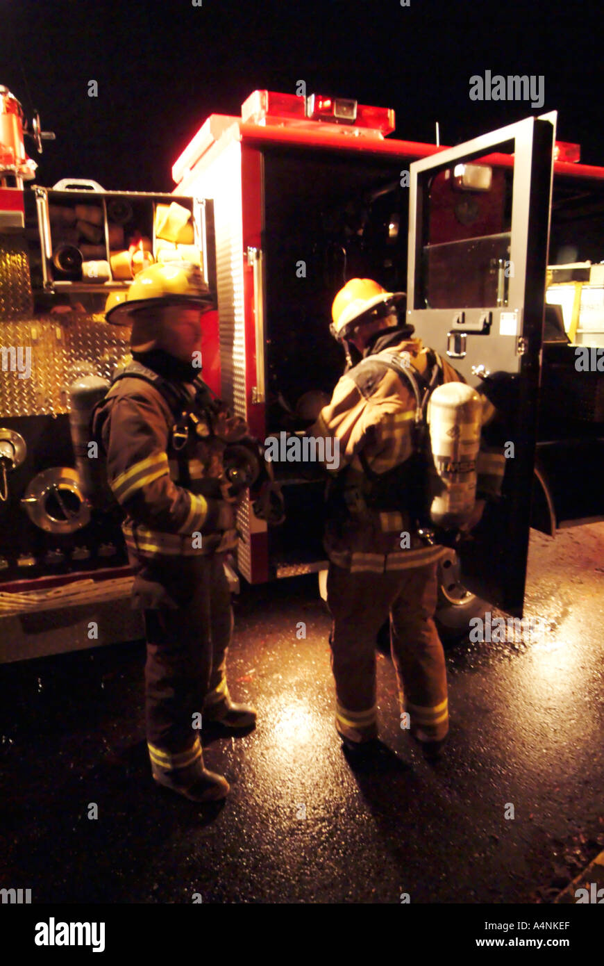 Volunteer firefighters practice fighting a school fire during a ...
