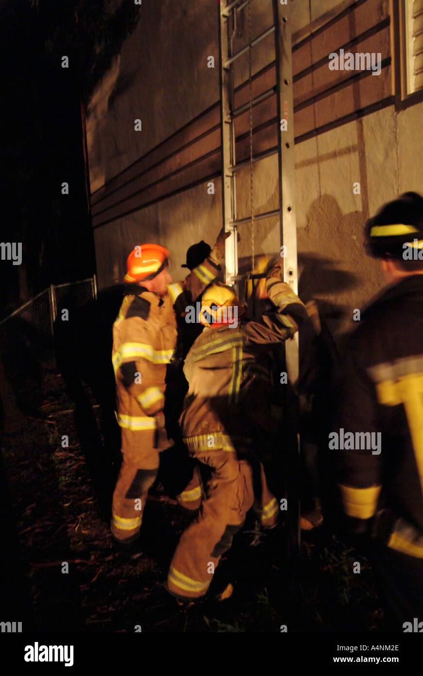 Firefighter trainees practice their skills with ladders Stock Photo - Alamy