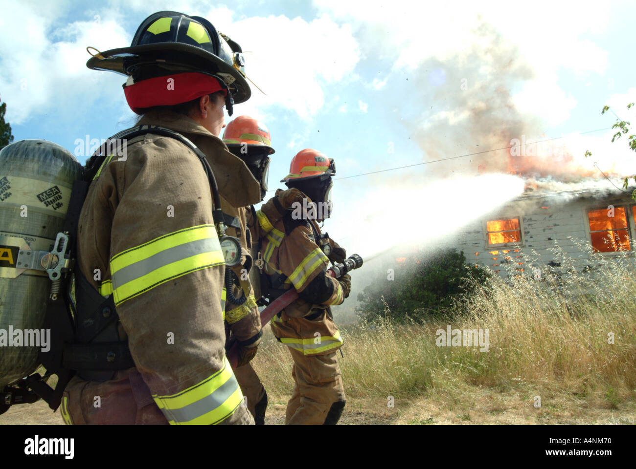 Firefighters from the Occidental Volunteer Fire Department fight a ...
