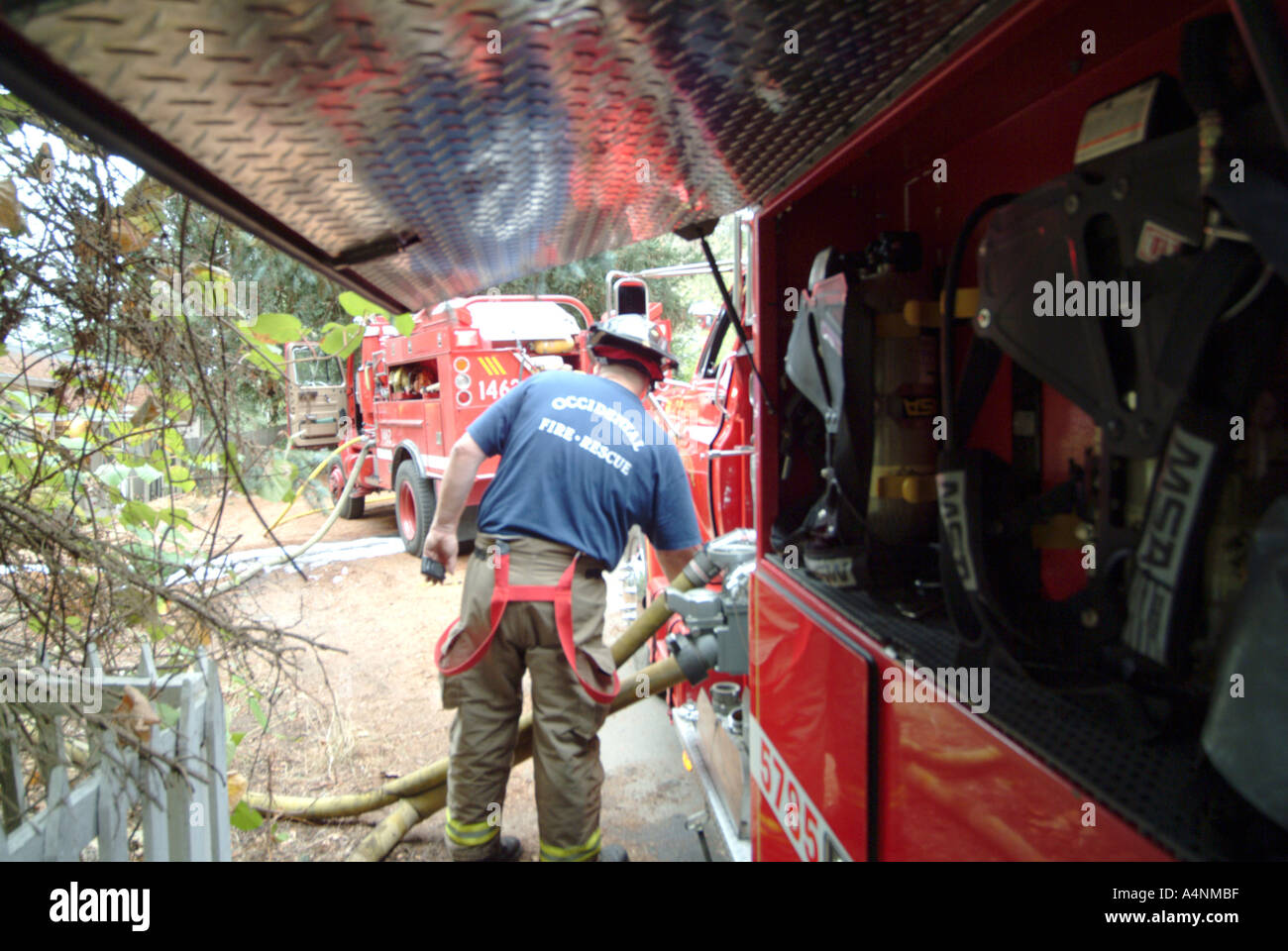 Fire fighters from several agencies clean up after a structure fire on ...