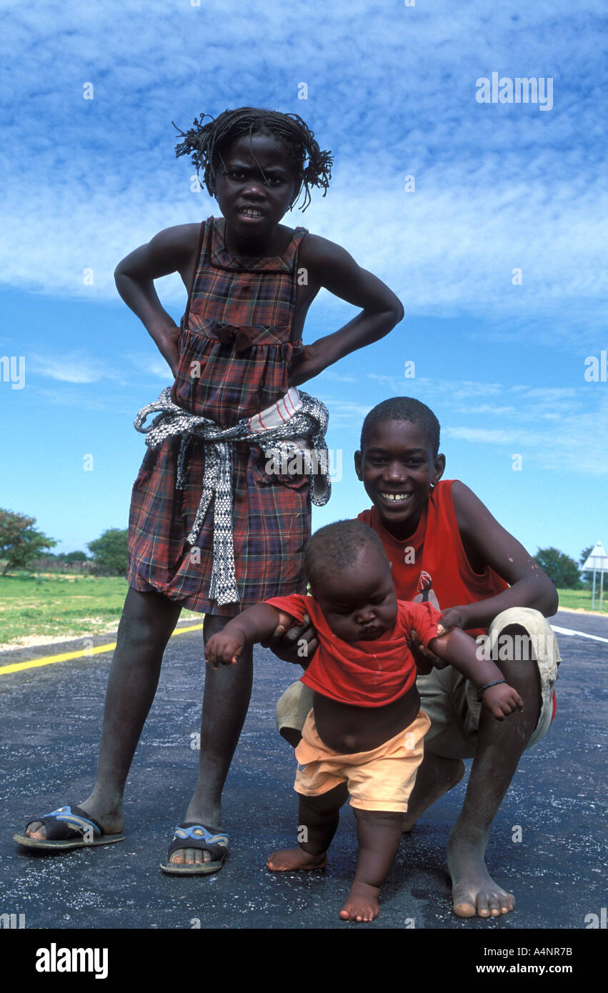 Ovambo tribe children posing with sibling toddler near Kamanjab ...