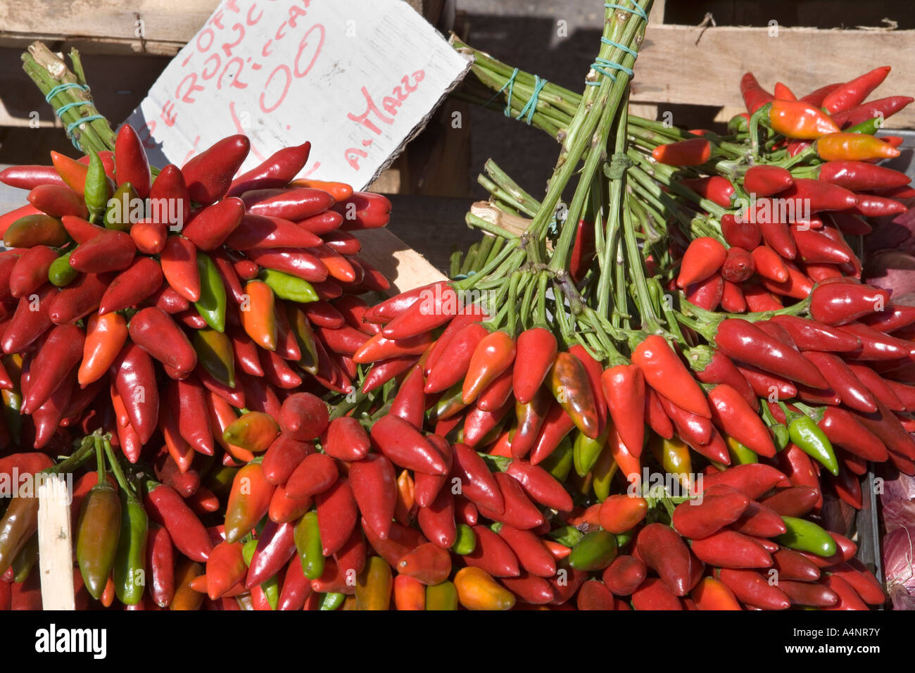 Chilli peppers on a market stall Cisternino Puglia Italy Stock Photo ...