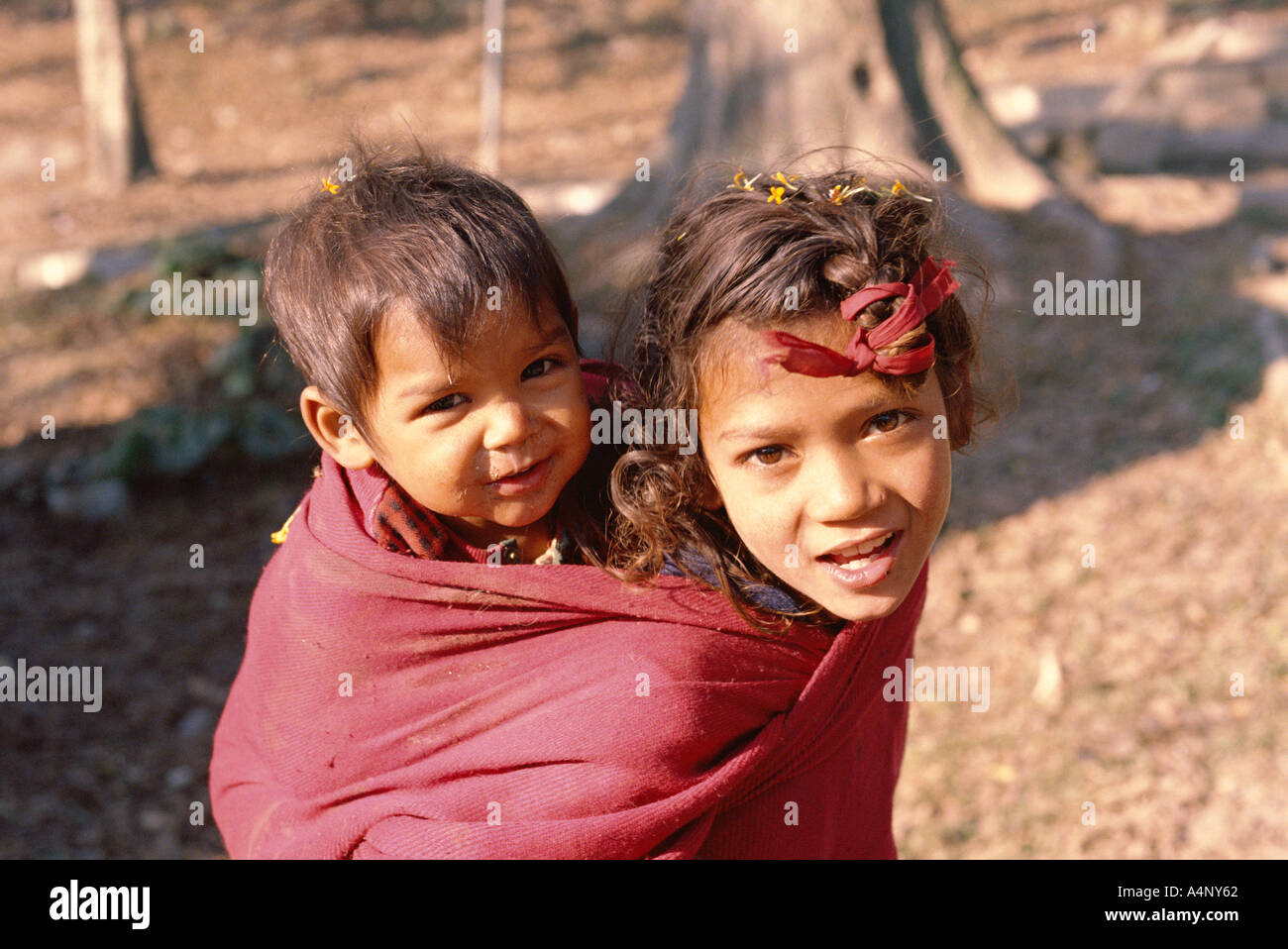 Boy carrying sister on shoulders hi-res stock photography and images ...