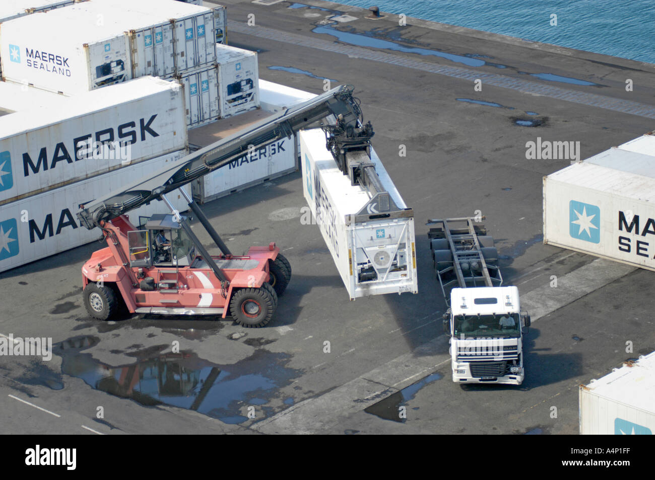 Shipping Containers being loaded on trucks in the port of Martinique in ...