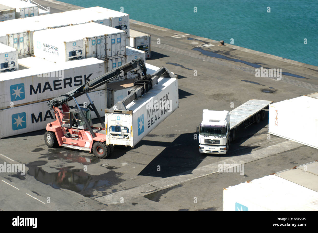 Shipping Containers being loaded on trucks in the port of Martinique in ...