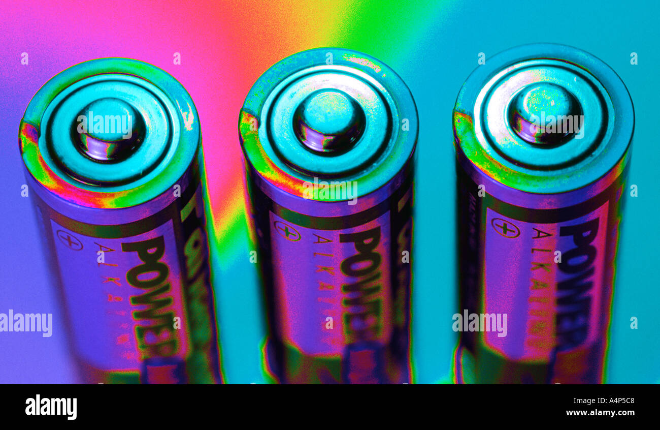 Three batteries standing on end Stock Photo - Alamy