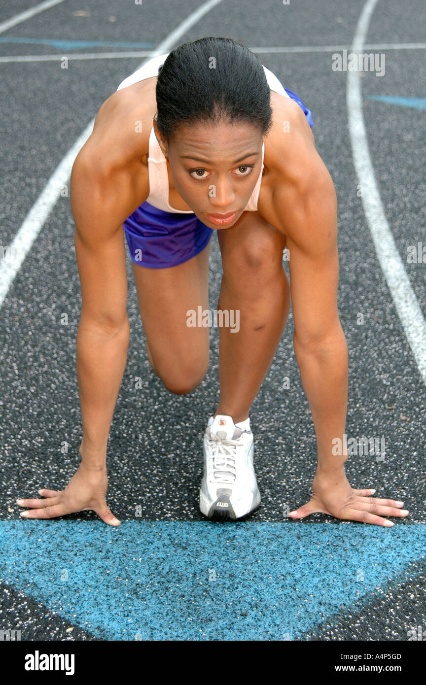Black African-American woman at the starting line of a track and field ...