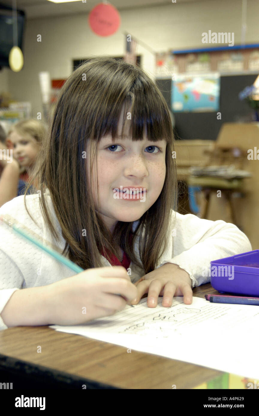 Third grade elementary students in a learning situation Stock Photo - Alamy