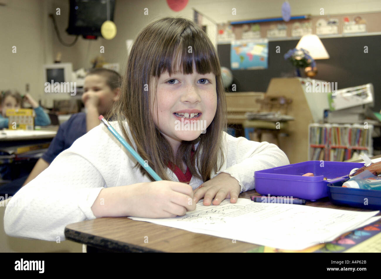 Third grade elementary students in a learning situation Stock Photo - Alamy