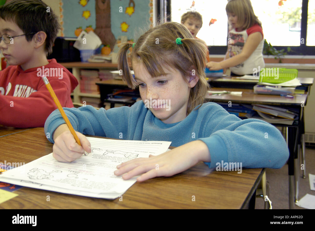 Third grade elementary students in a learning situation Stock Photo - Alamy