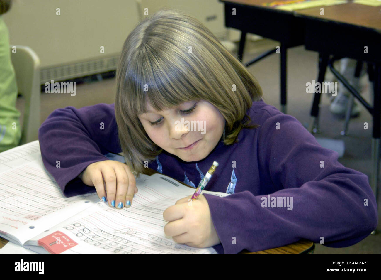 Grade 3 male and female students in a classroom learning situation ...