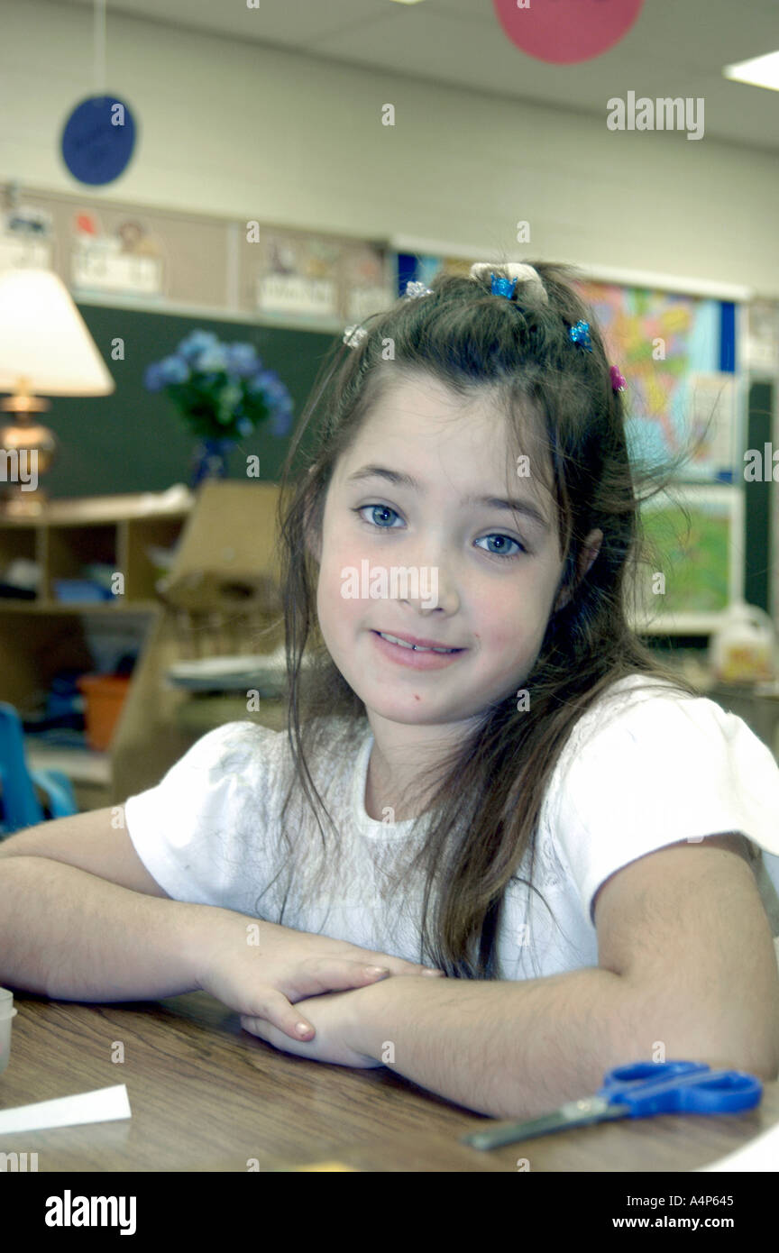 Grade 3 male and female students in a classroom learning situation ...