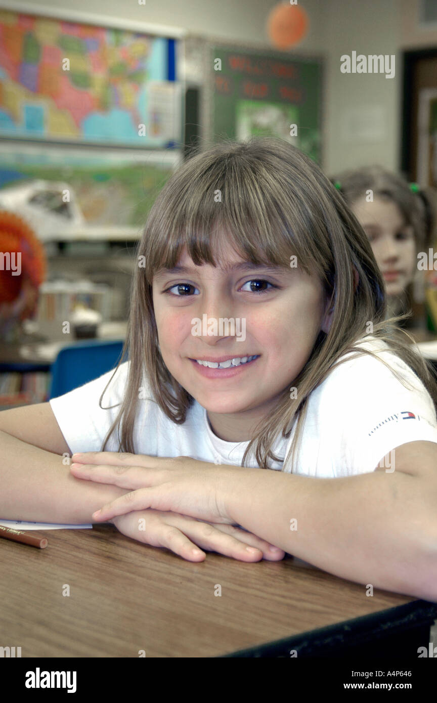 Grade 3 male and female students in a classroom learning situation ...