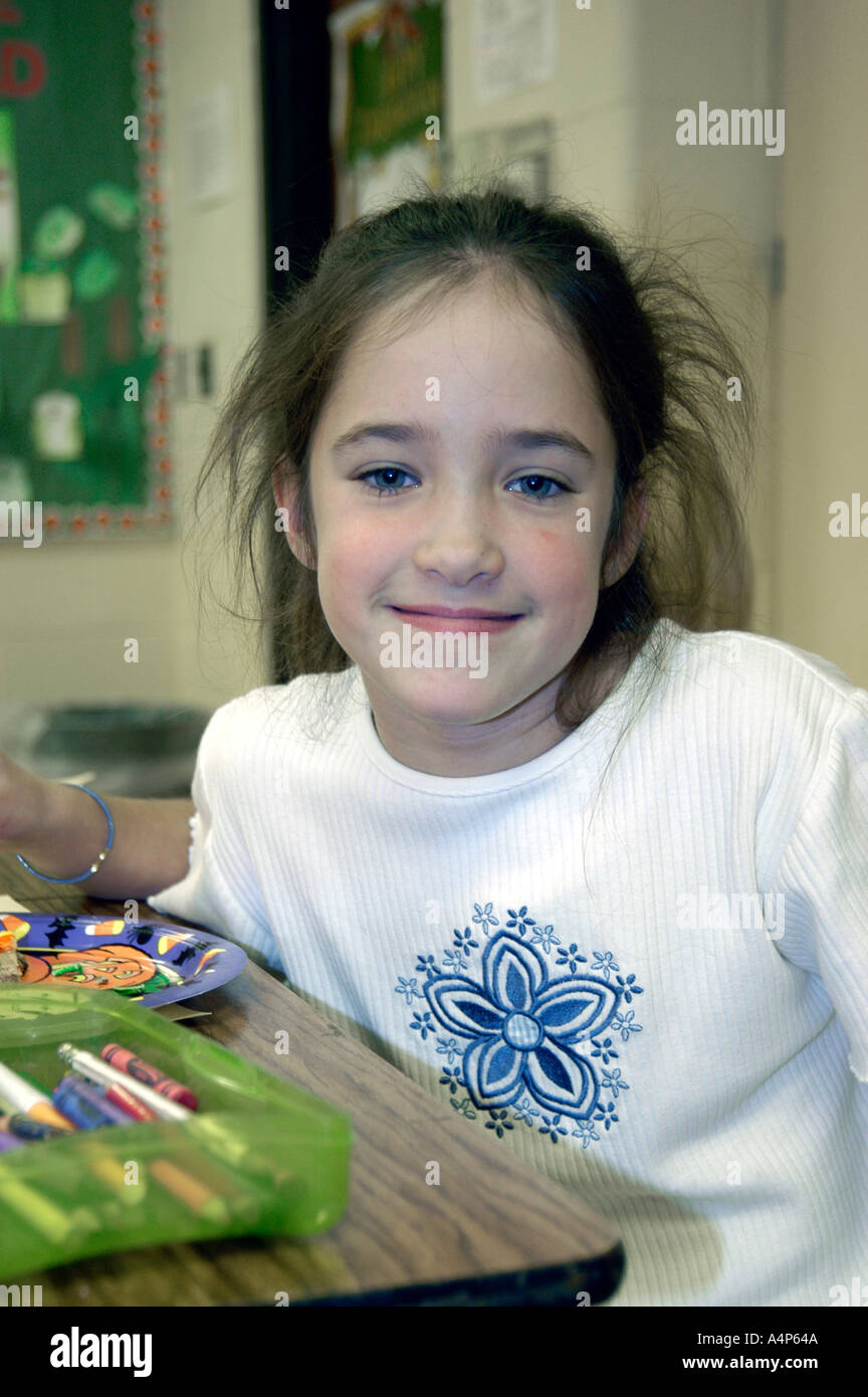 Grade 3 male and female students in a classroom learning situation ...