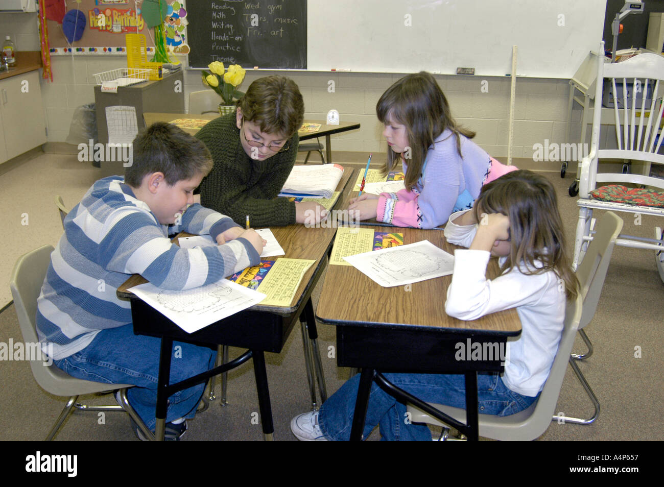 Grade 3 male and female students in a classroom learning situation ...