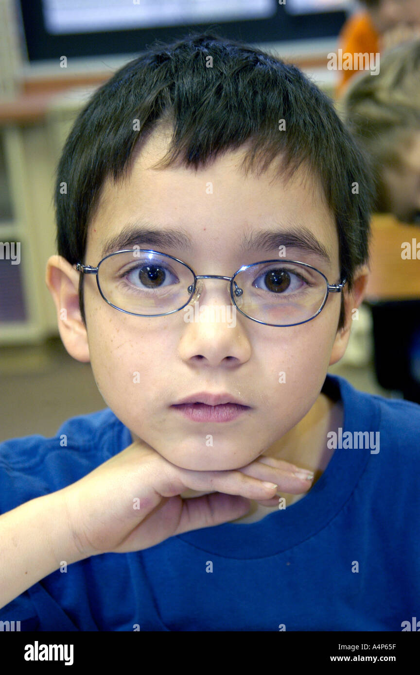 Grade 3 male and female students in a classroom learning situation ...