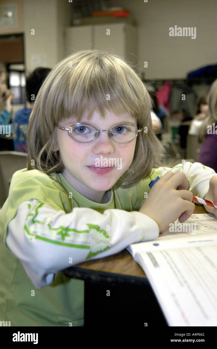 Grade 3 male and female students in a classroom learning situation ...
