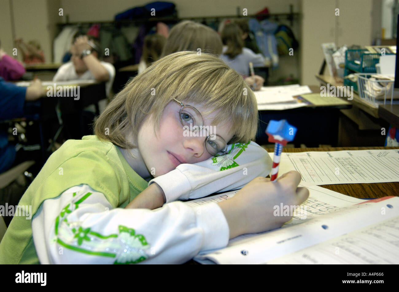 Grade 3 male and female students in a classroom learning situation ...
