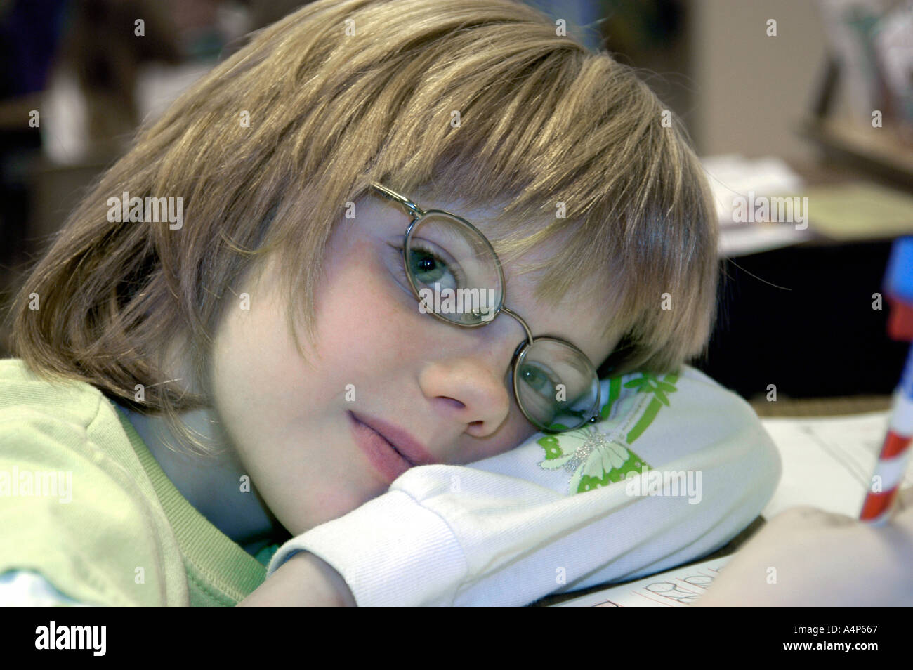Grade 3 male and female students in a classroom learning situation ...