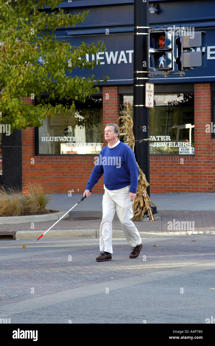 Blind man crosses street at a busy intersection Stock Photo - Alamy